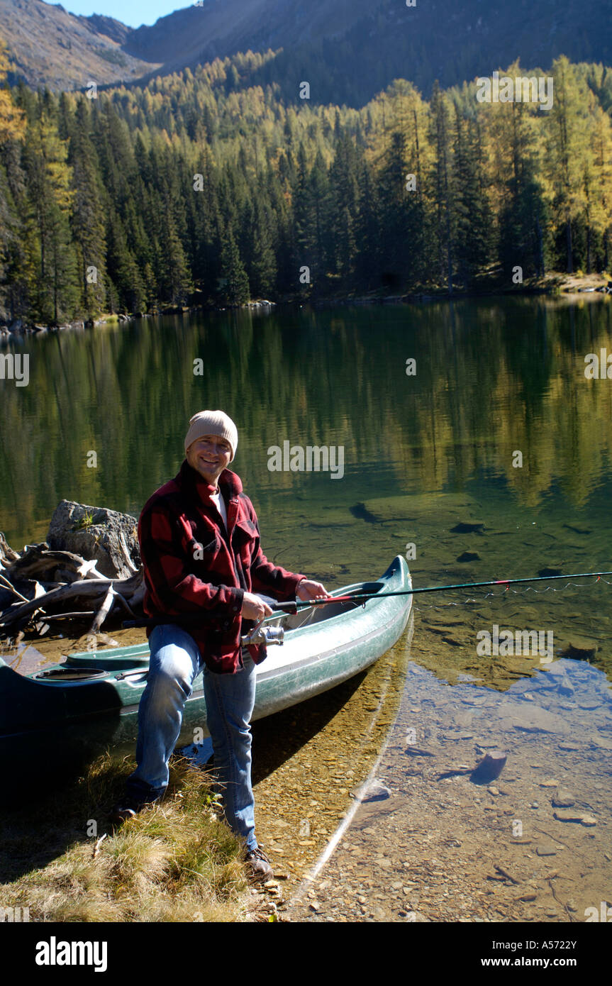 Man fishing in lake Stock Photo - Alamy