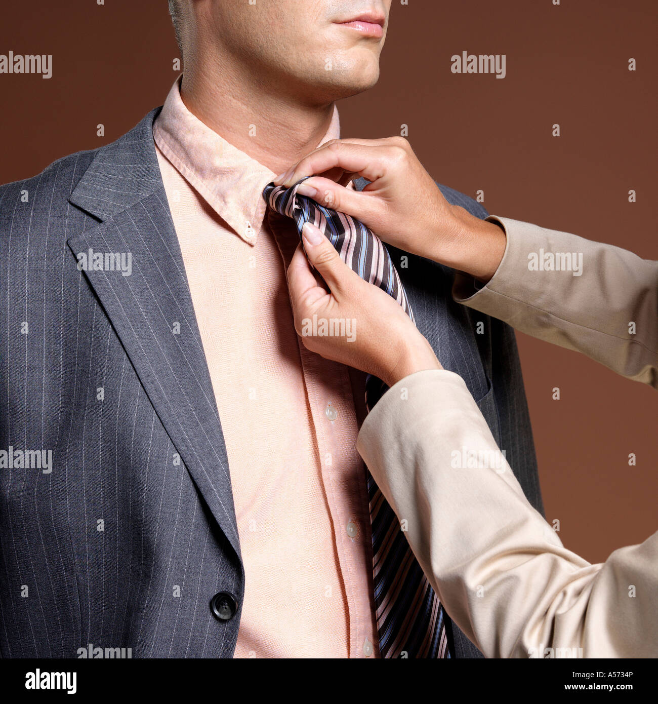 Woman binding man tie hi-res stock photography and images - Alamy