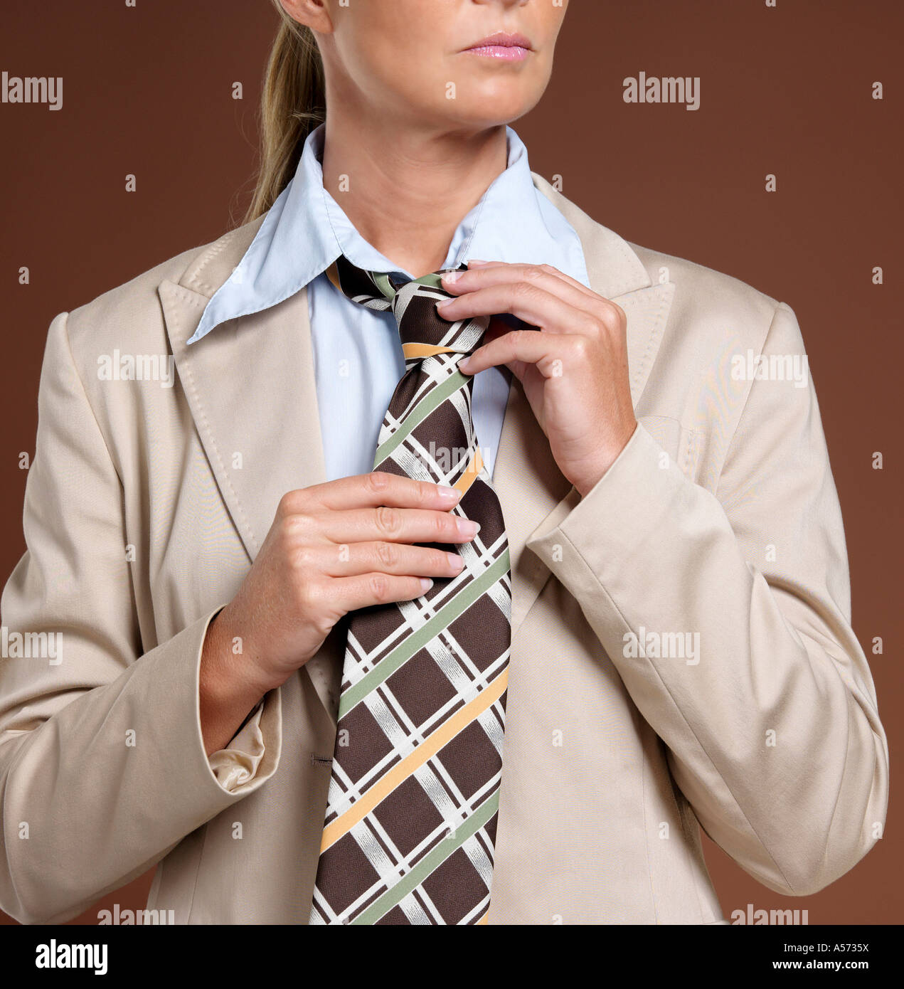 Businesswoman wearing suit and tie Stock Photo - Alamy
