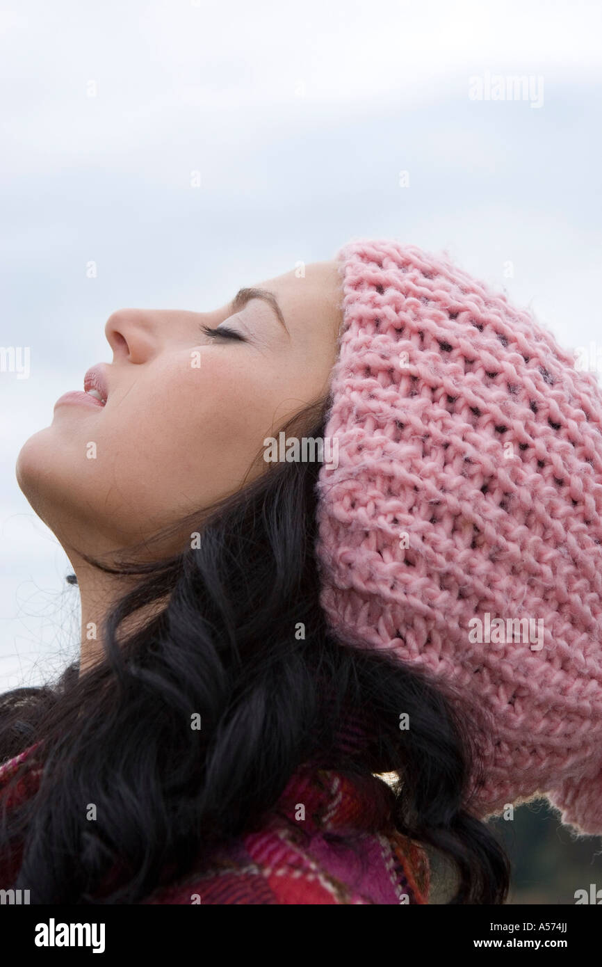 Young woman wearing cap, eyes closed, side view Stock Photo - Alamy