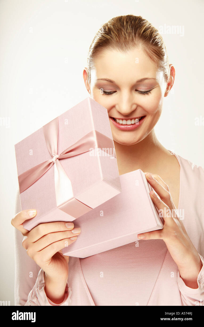 Presents opening standing hi-res stock photography and images - Alamy