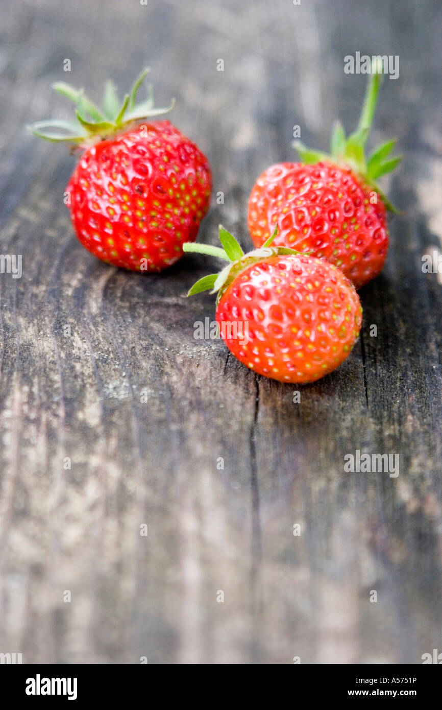 Three strawberries, close-up Stock Photo - Alamy