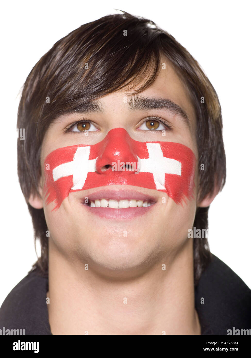 Young man with Swiss flag painted on face Stock Photo - Alamy