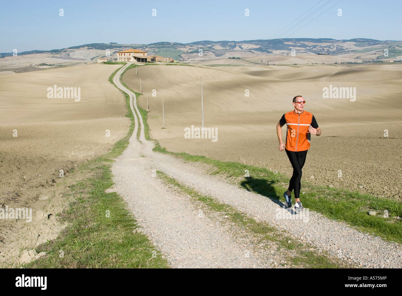 Italy, Tuscany, man jogging Stock Photo - Alamy