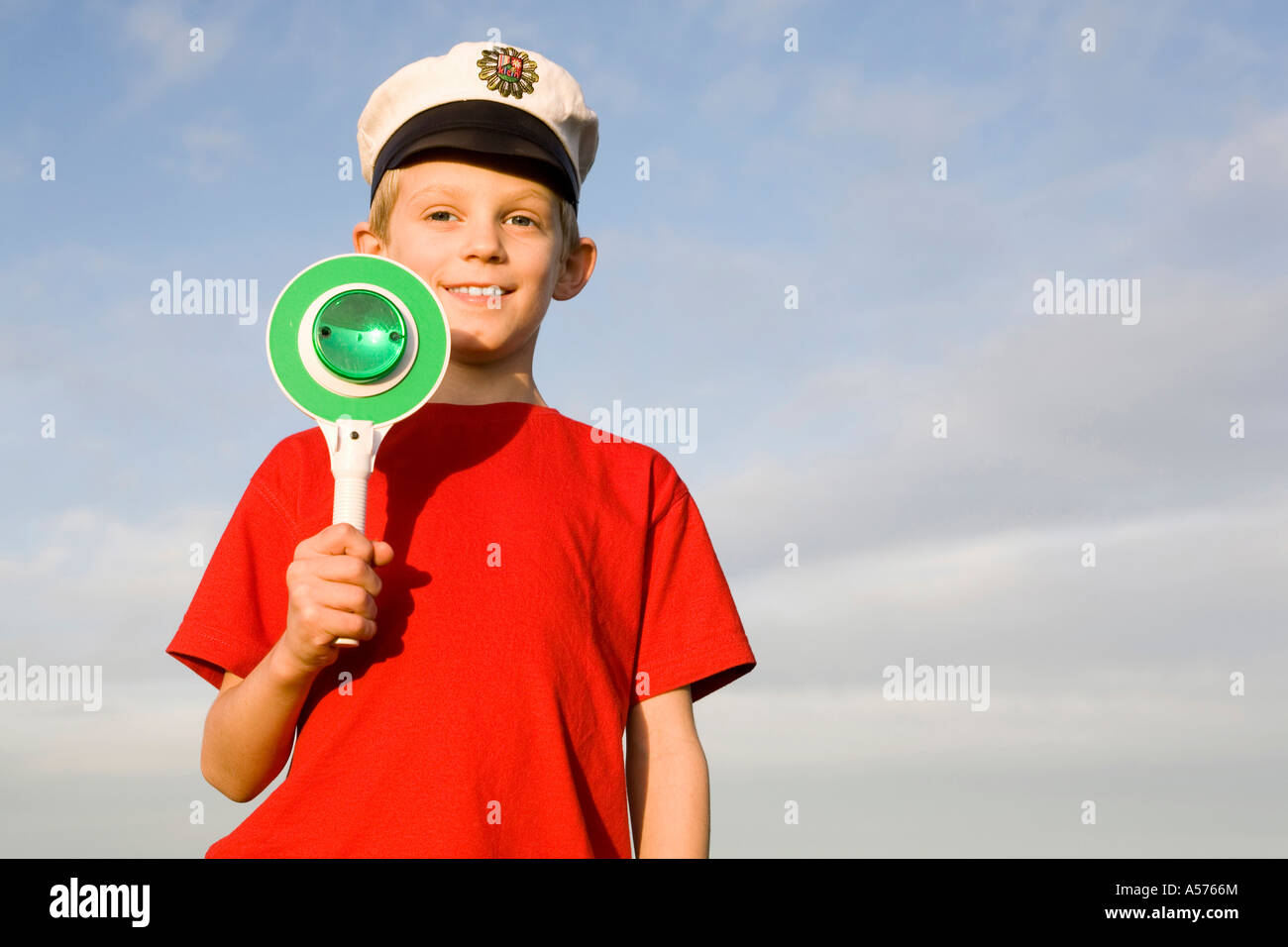 Boy (10-13) wearing police cap Stock Photo - Alamy