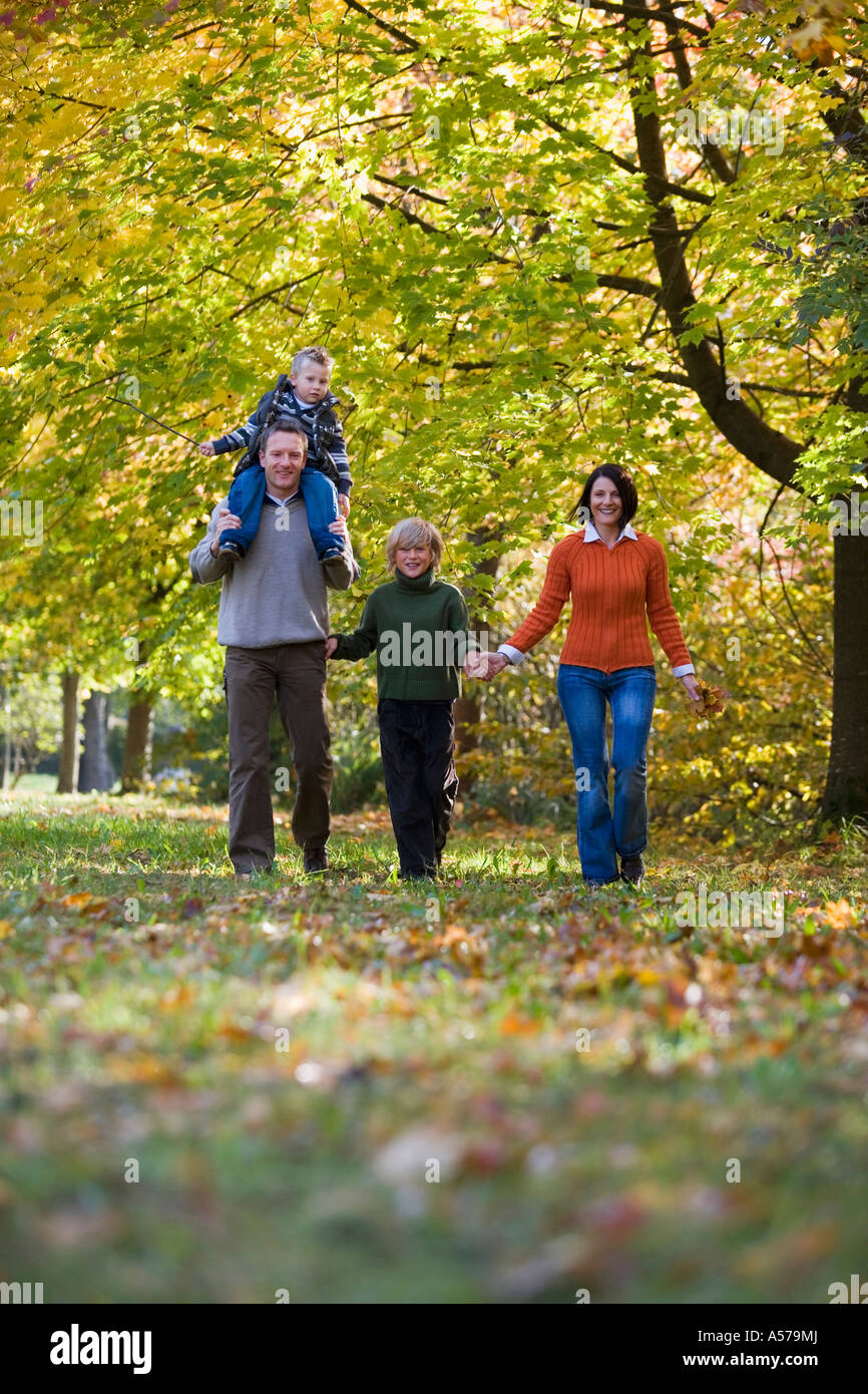 Parents and two sons having a walk Stock Photo - Alamy