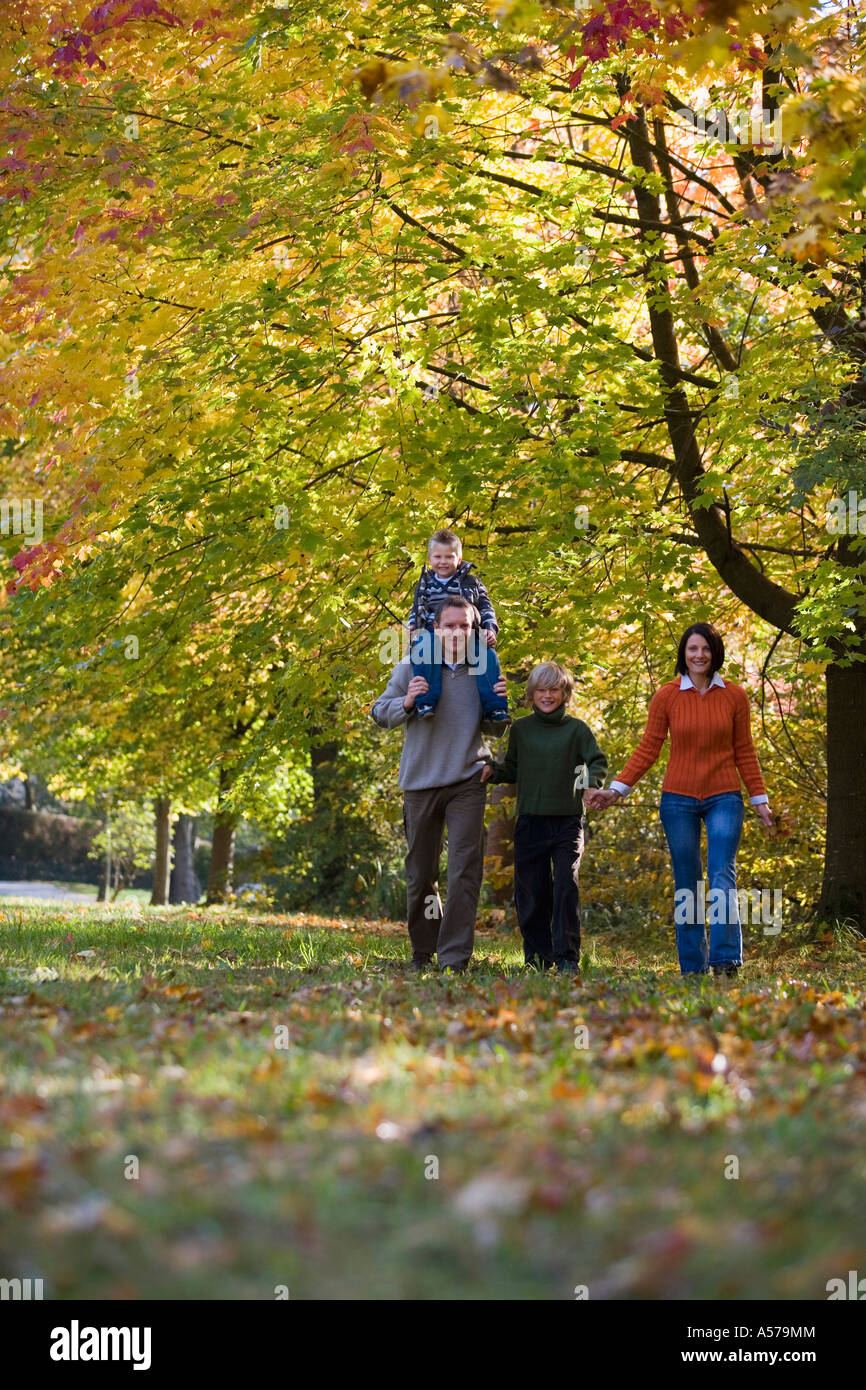 Parents with children (6-11) in park, smiling Stock Photo - Alamy