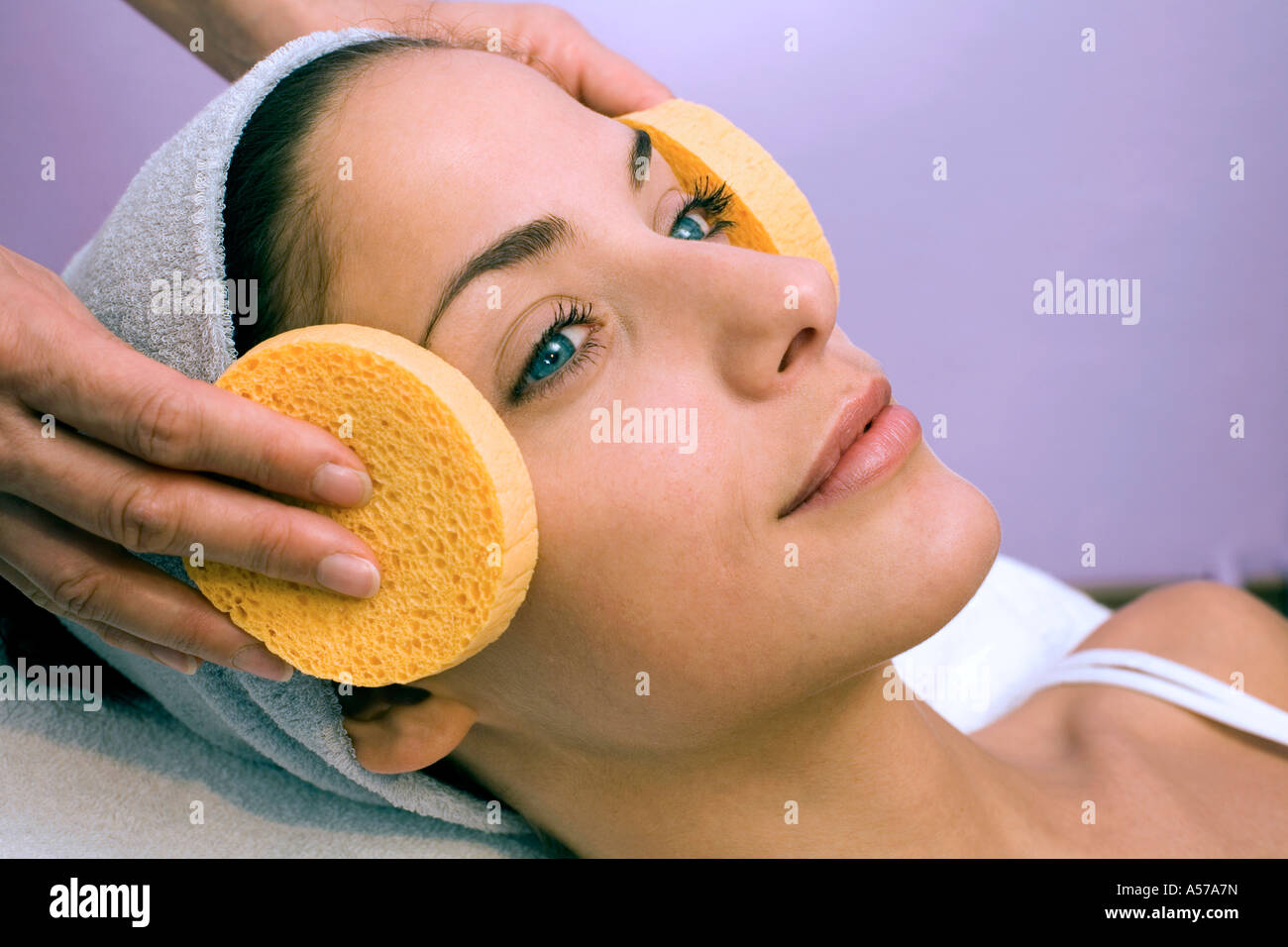 Woman receiving face treatment Stock Photo - Alamy