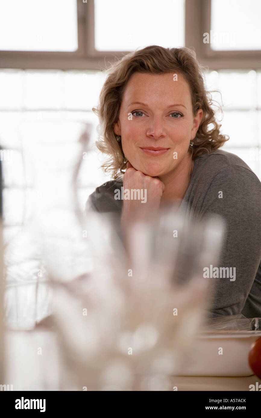 Smiling housewife in kitchen hi-res stock photography and images - Alamy