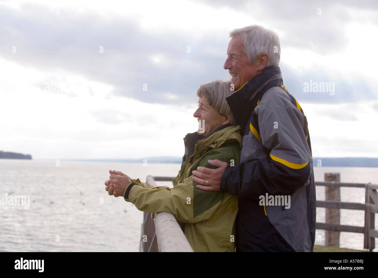 Senior couple standing on jetty, side view Stock Photo - Alamy