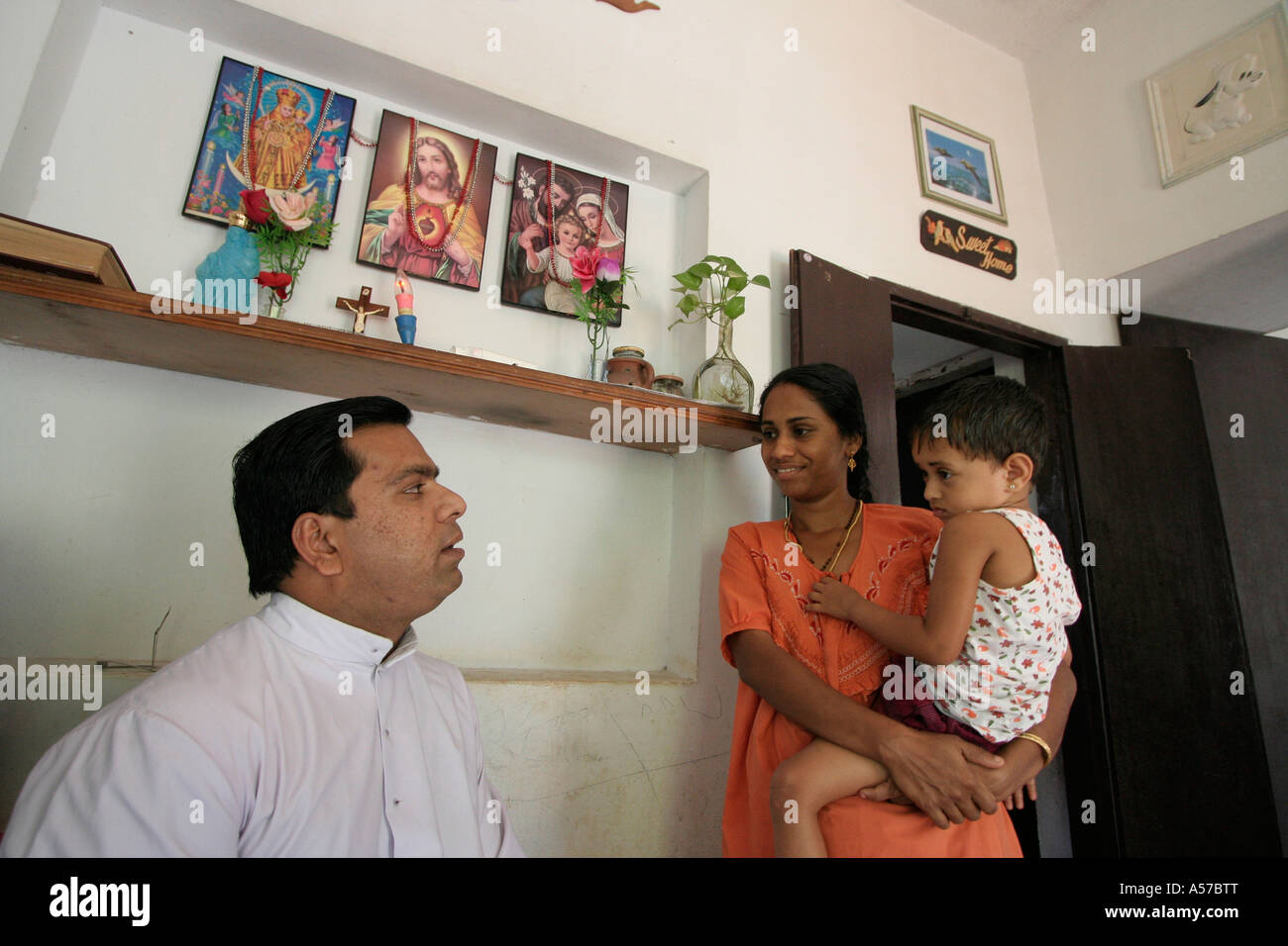 jc3149 india father joy cheradiyil wearing white cassock visiting home ...