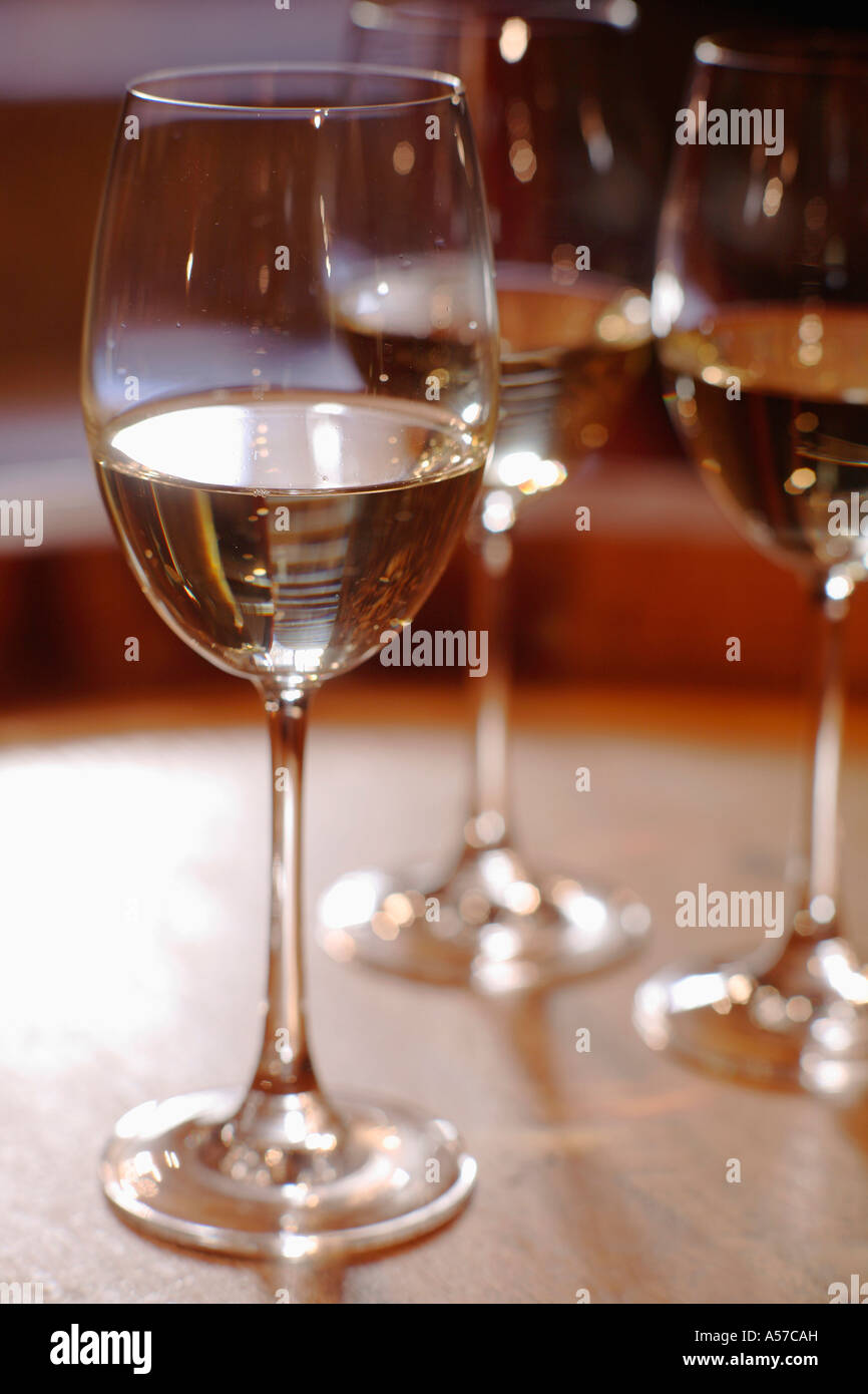 White wine in glasses on wine cask, close-up Stock Photo - Alamy