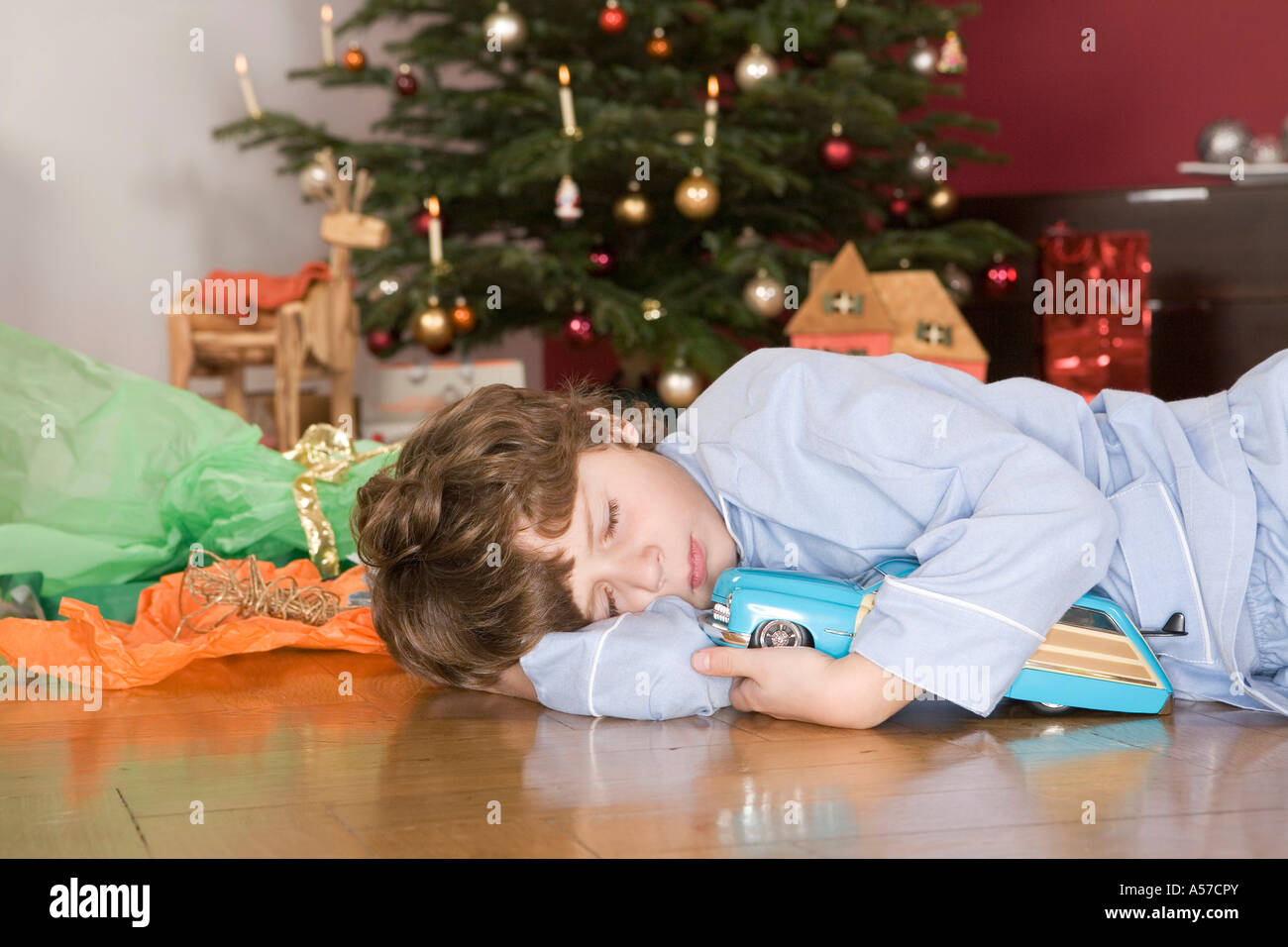 Boy sleeping under tree hi-res stock photography and images - Alamy