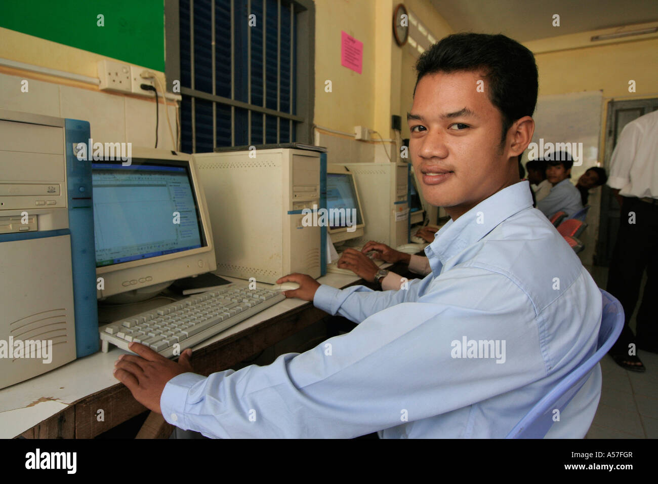 Painet je2218 boy teen cambodia computer students vocational training course run caritas phnom ...