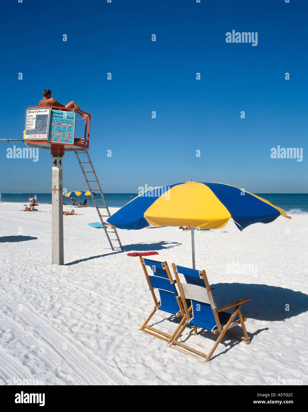 White lifeguard chair blue umbrella hi-res stock photography and images ...