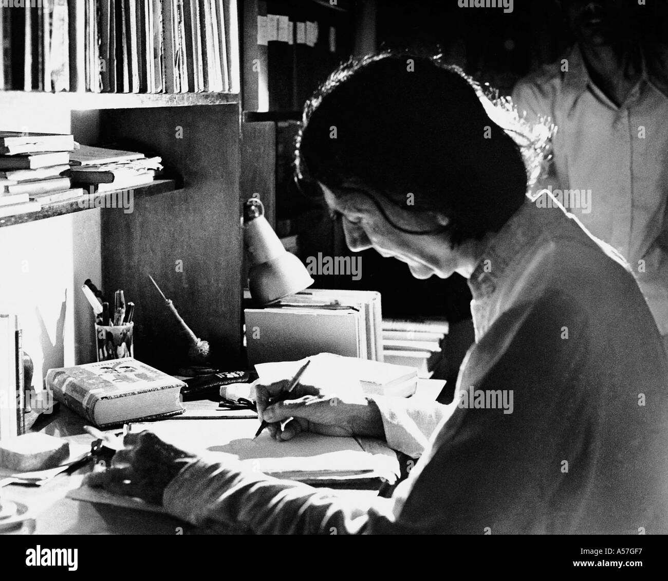 PCP088 Makarand Dave writer writing at his residence Bombay Mumbai ...