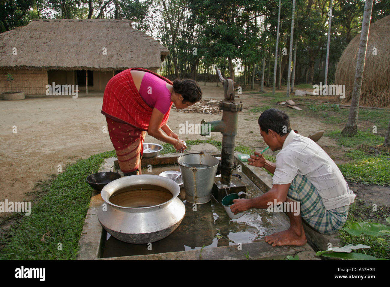 jf5265 bangladesh early morning ablutions garo tribal minority family ...