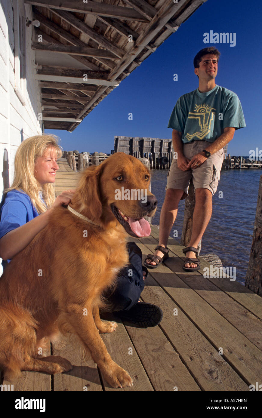 YOUNG COUPLE AND DOG AT HOKENSON BROTHERS FISHERY MUSEUM, APOSTLE ...