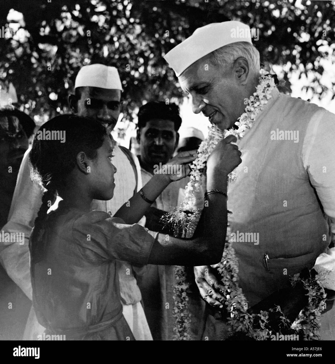PCP030 Pandit Jawaharlal Nehru being garlanded by small girl on visit ...
