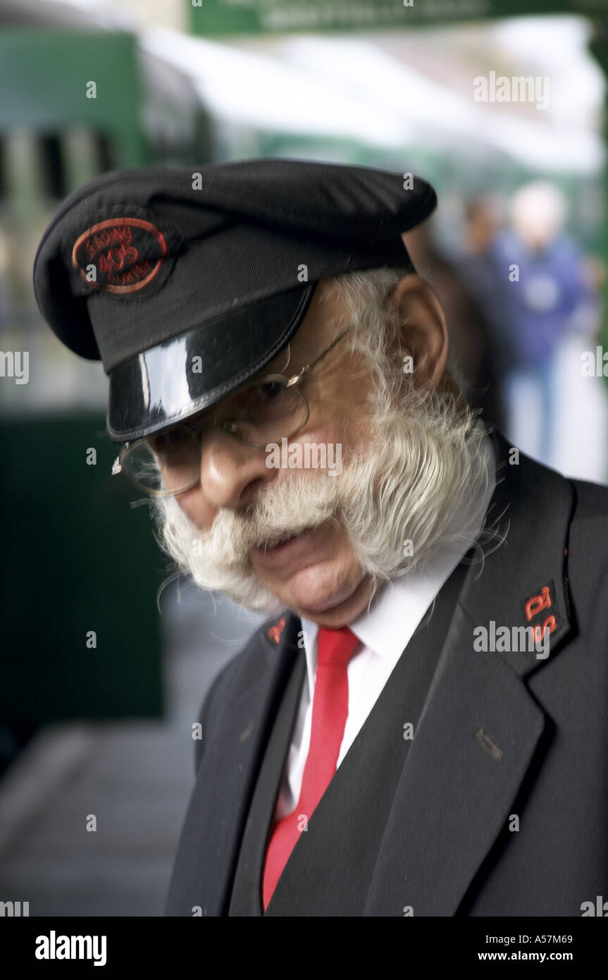 Ticket inspector with grey side whiskers or sideburns and Moustache on ...