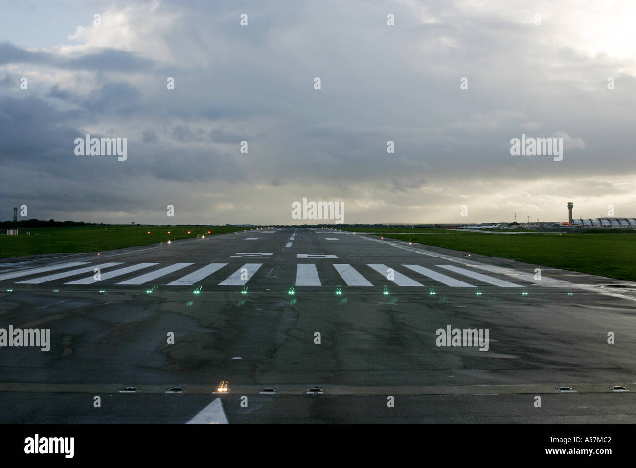 View down main runway with lights at Luton Airport Bedfordshire England ...