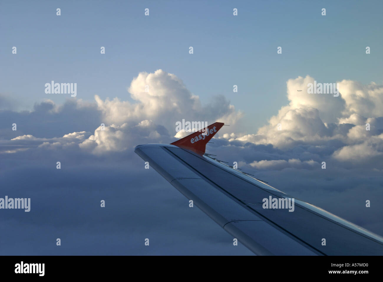 Aerial scenic view of clouds from the air with Easyjet aircraft wing ...