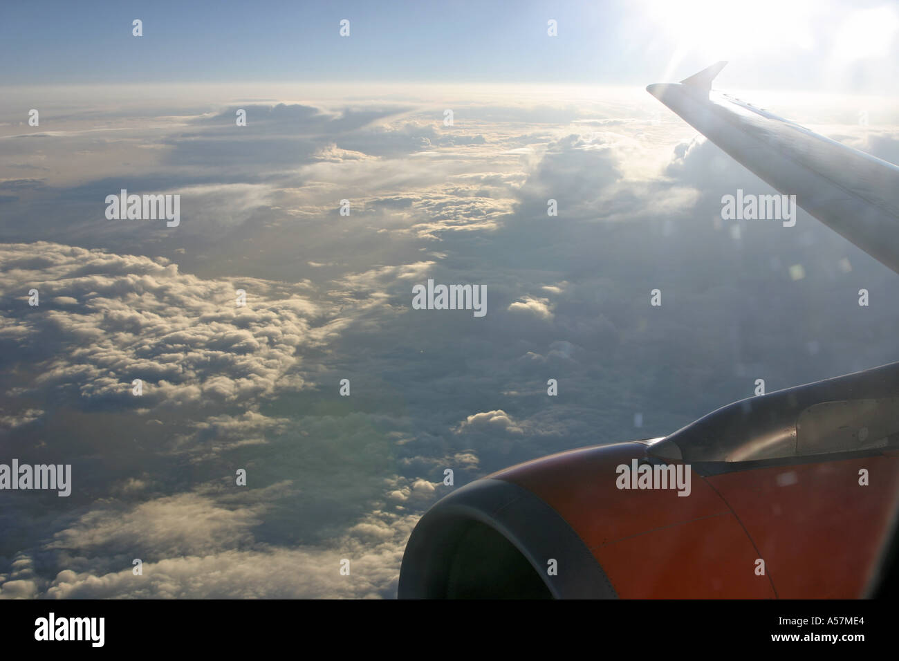 Aerial scenic view of clouds from the air with Easyjet aircraft engine ...
