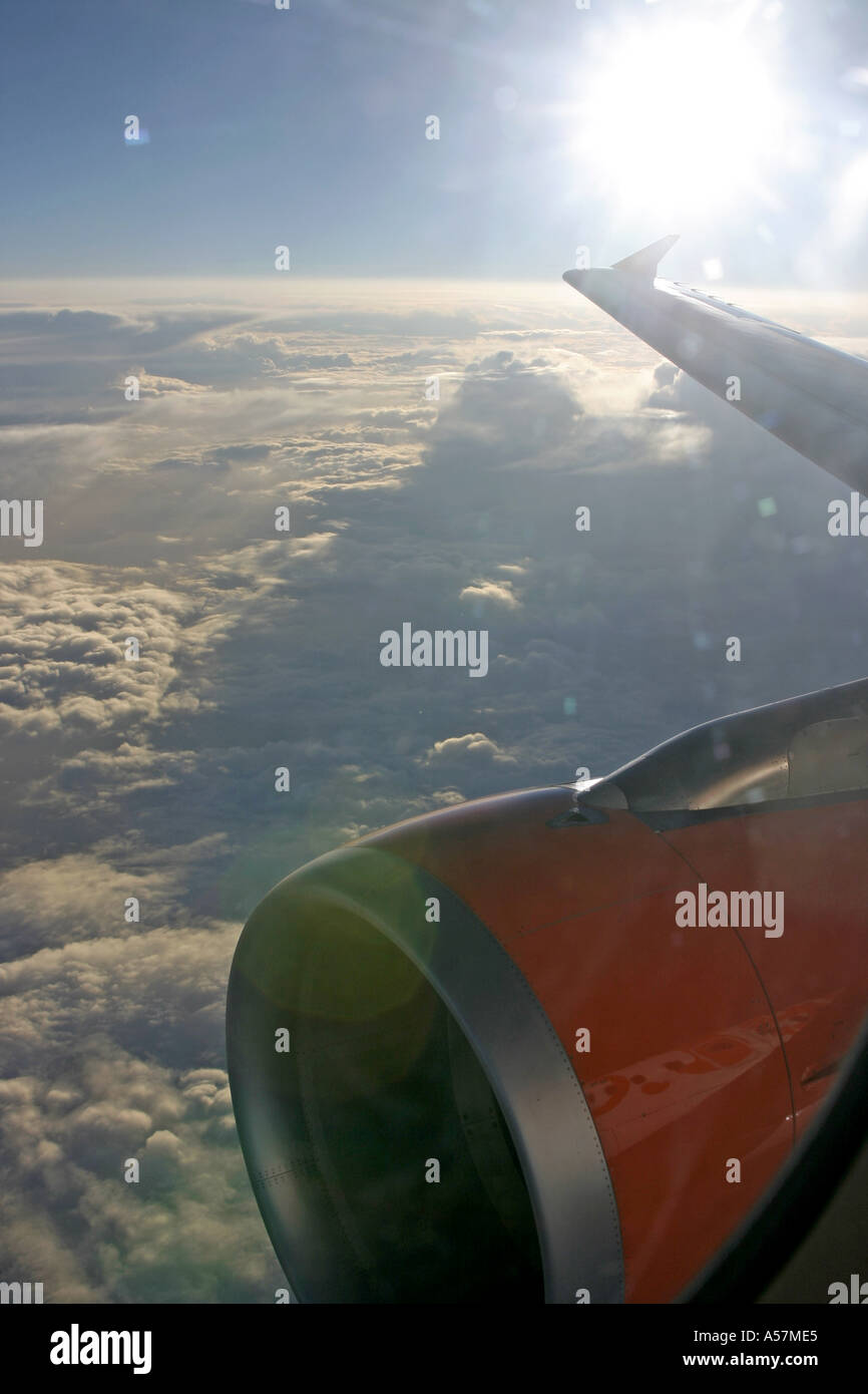 Aerial scenic view of clouds from the air with Easyjet aircraft engine ...