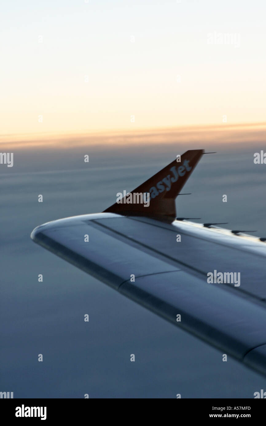 Aerial scenic view of clouds from the air with Easyjet aircraft wing ...