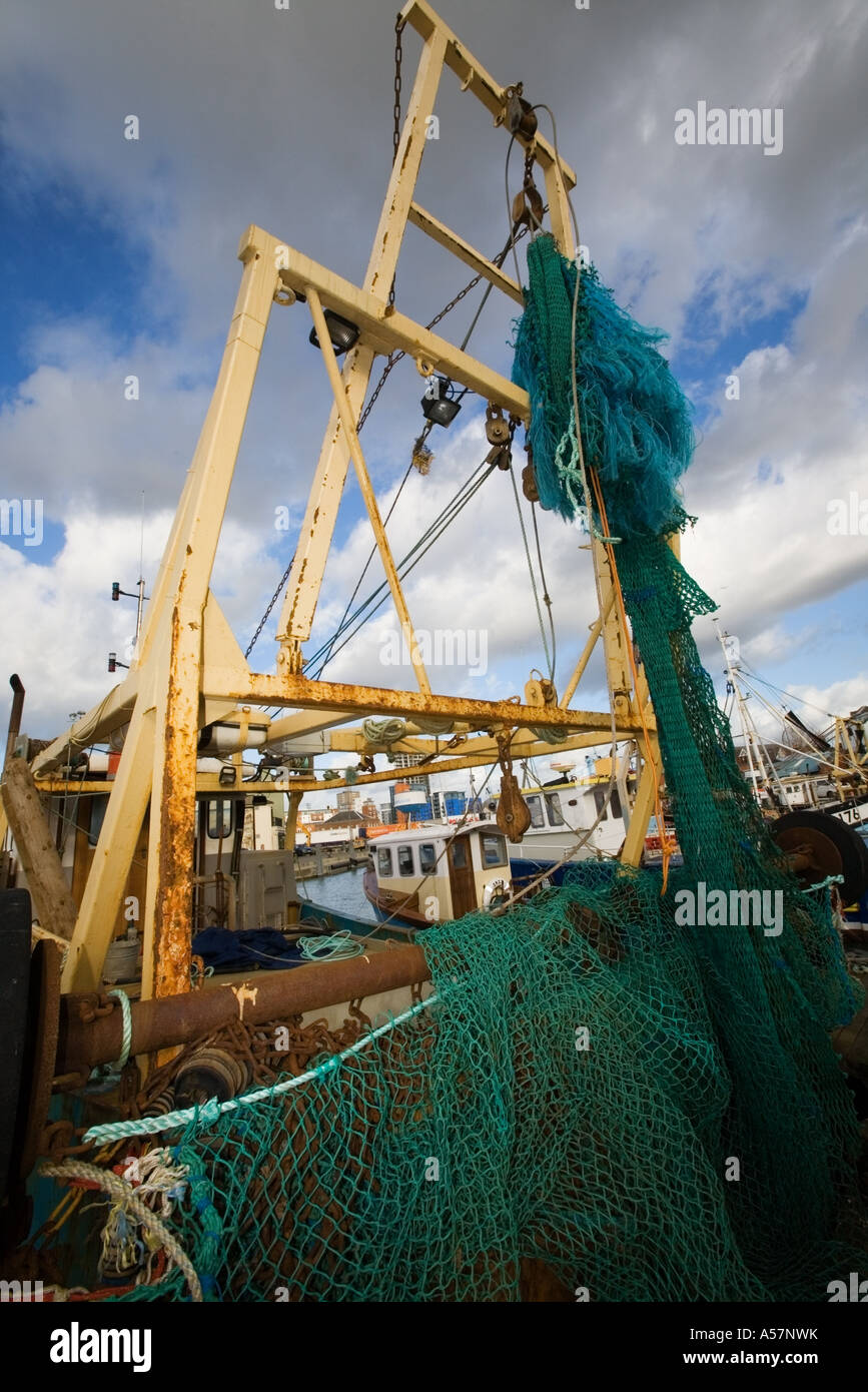 Portrait of colourful fishing nets hanging up in Old Portsmouth harbour ...