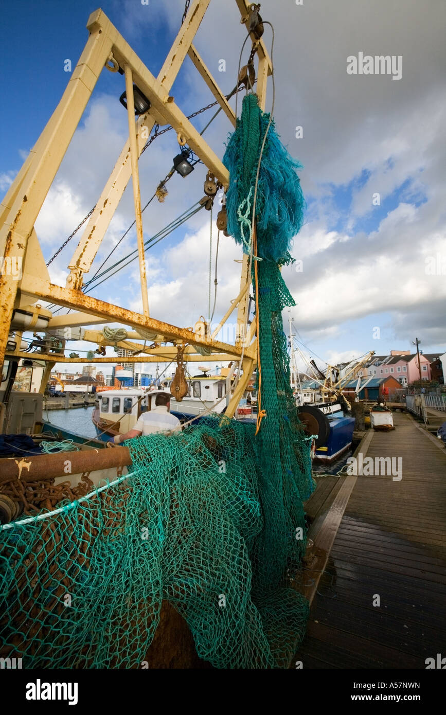Portrait of colourful fishing nets hanging up in Old Portsmouth harbour ...