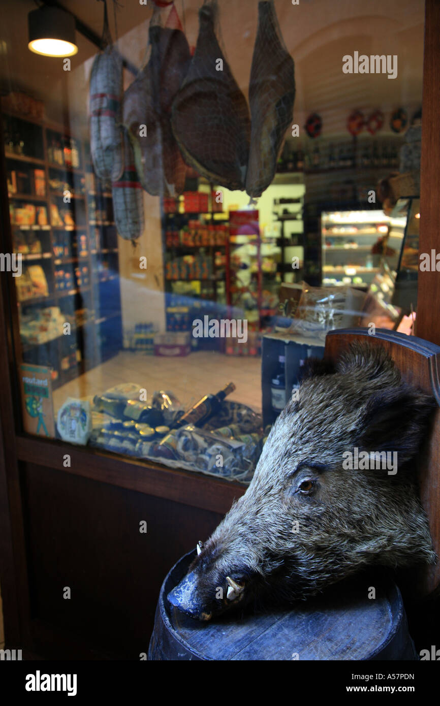 a butcher’s and a head of boar on display Stock Photo - Alamy