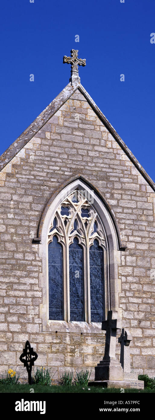 Christian church building with graves window and cross Tyneham Village ...