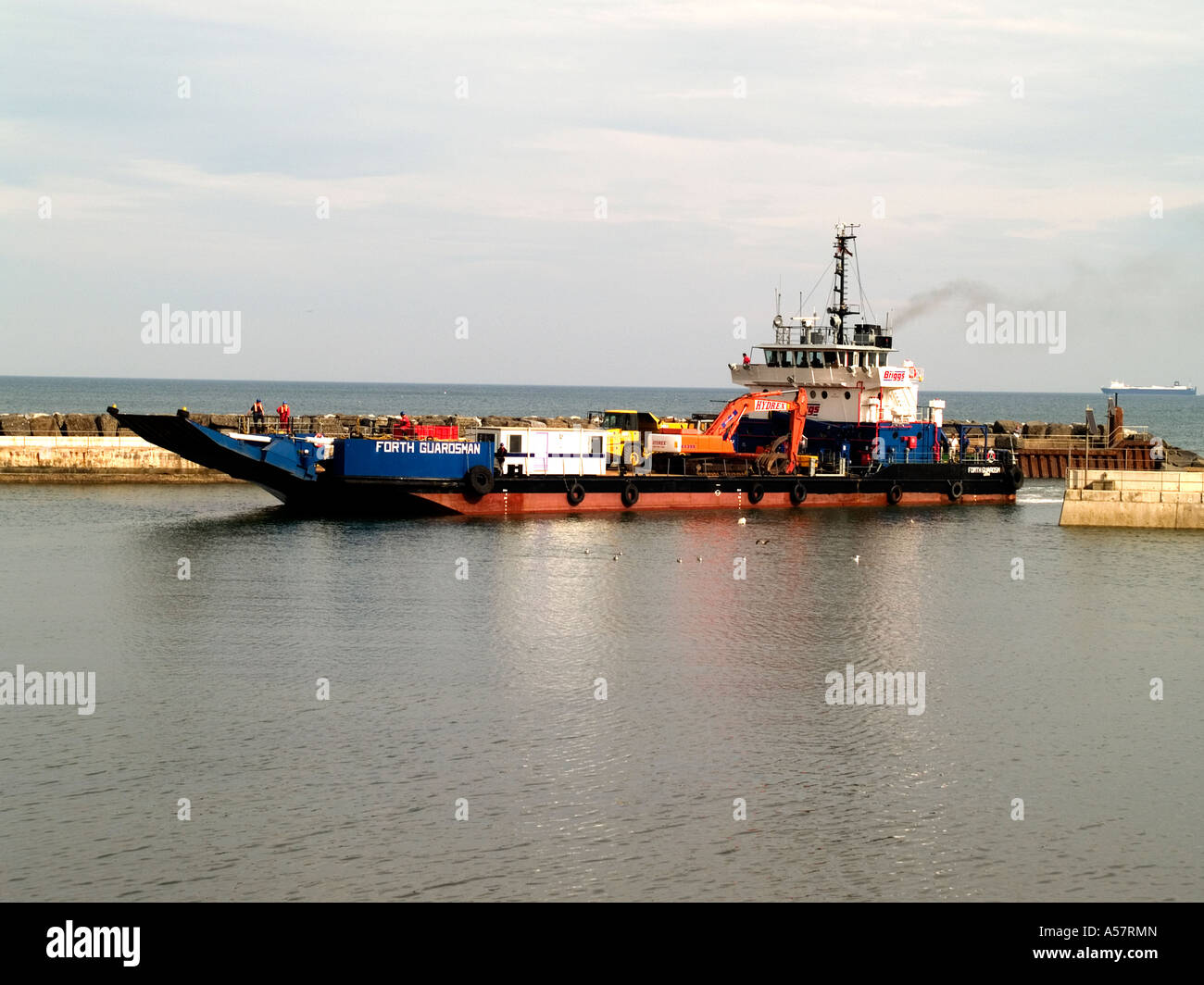 Inshore maintenance vessel Forth Guardsman entering Staithes harbour to do maintenance work on ...
