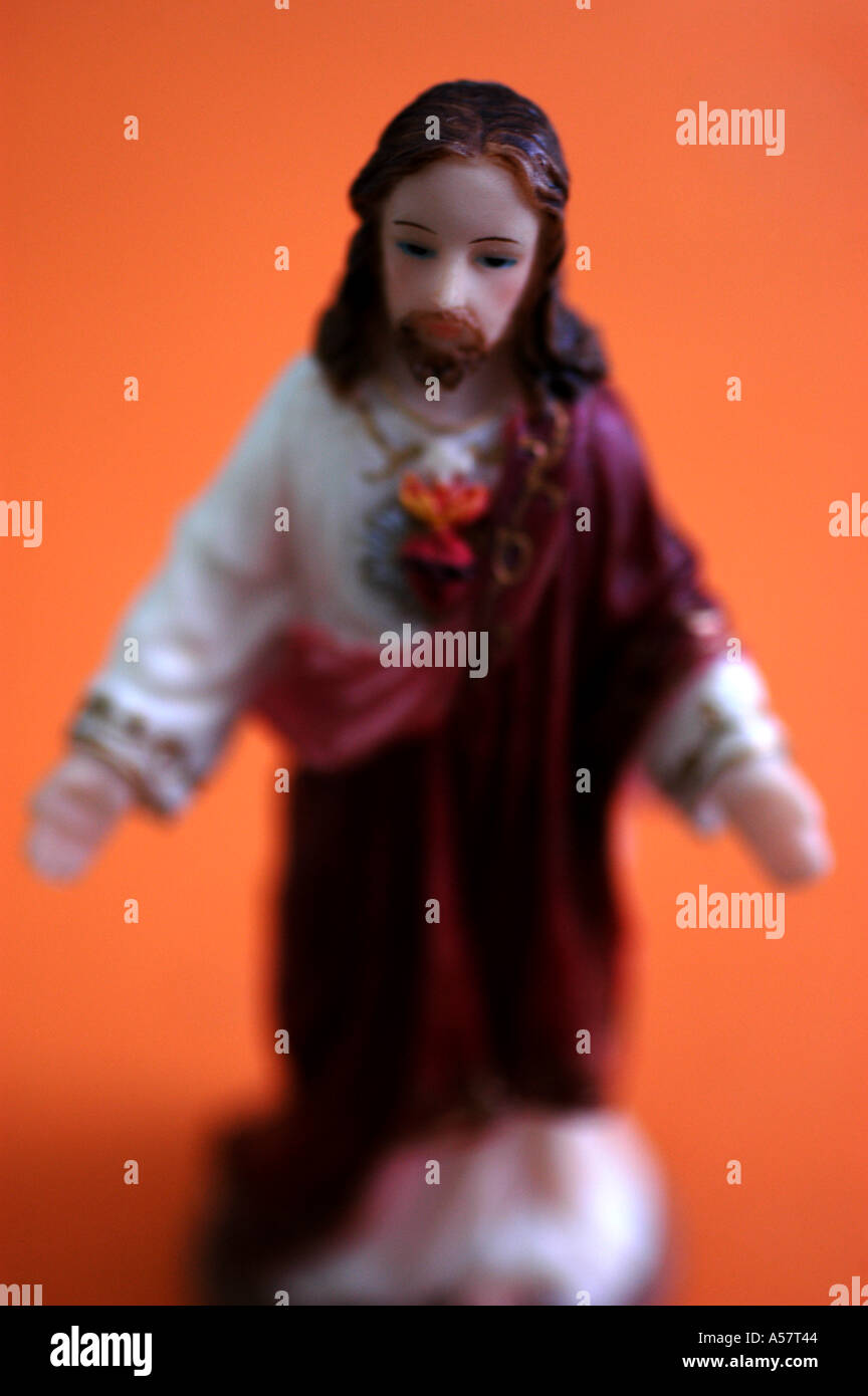 Plastic Jesus Icon on orange background Stock Photo - Alamy