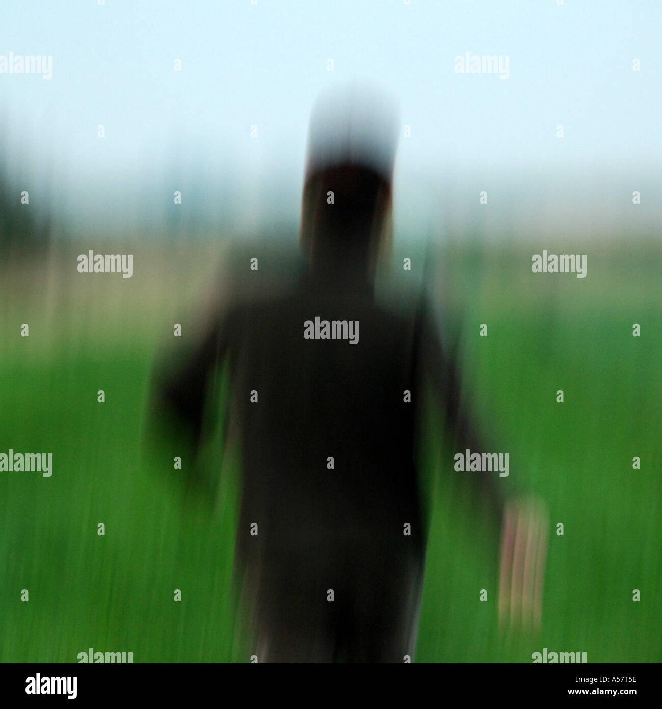 Shadowy man walking away hi-res stock photography and images - Alamy