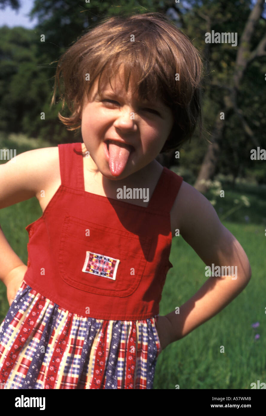 child sticking out tongue outside Stock Photo - Alamy