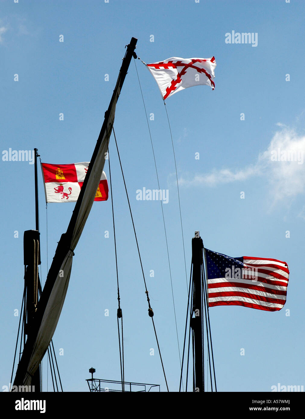 Three flags on masts Stock Photo - Alamy