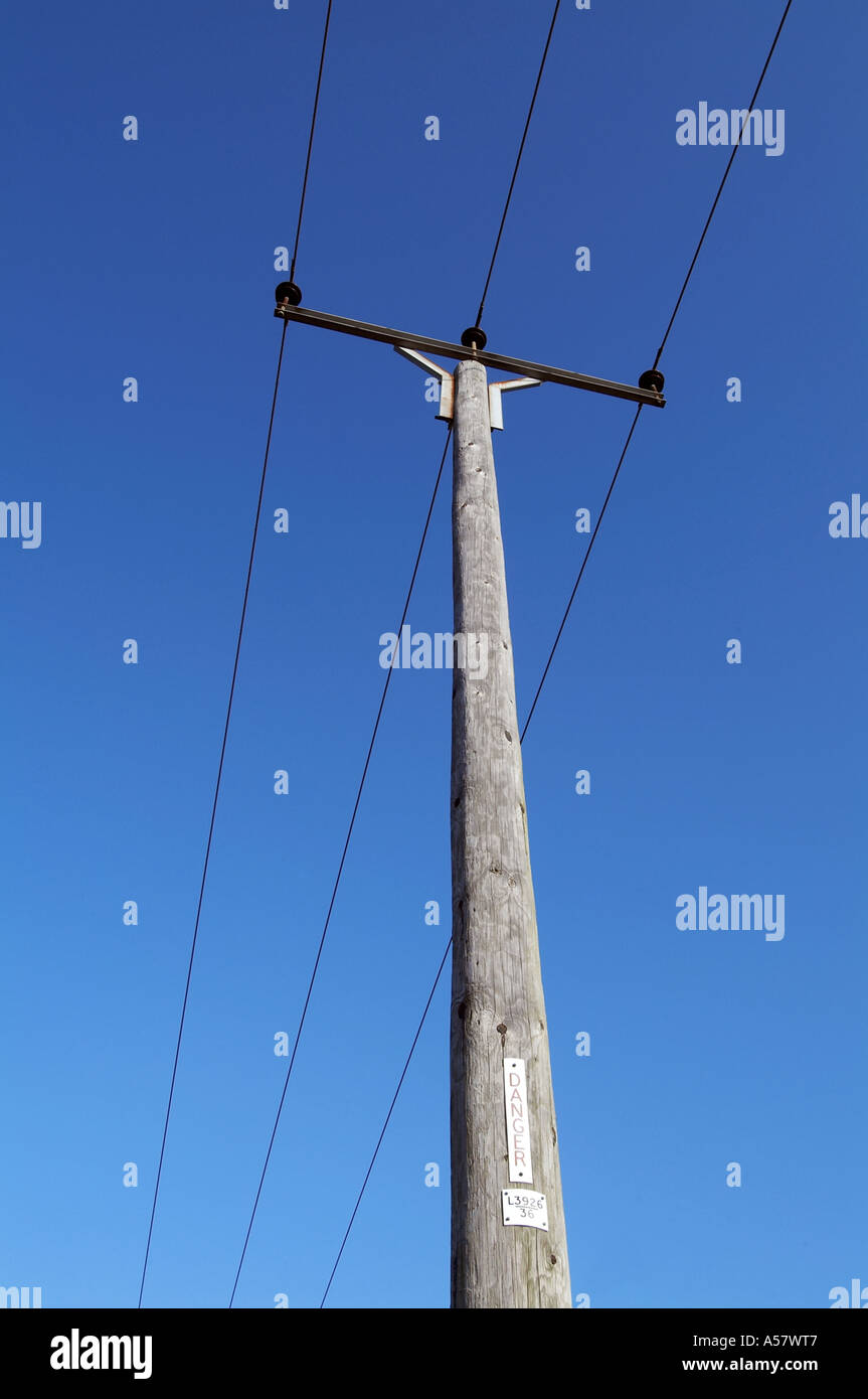 Electrical power lines and pylons against a blue sky Europe, UK england ...