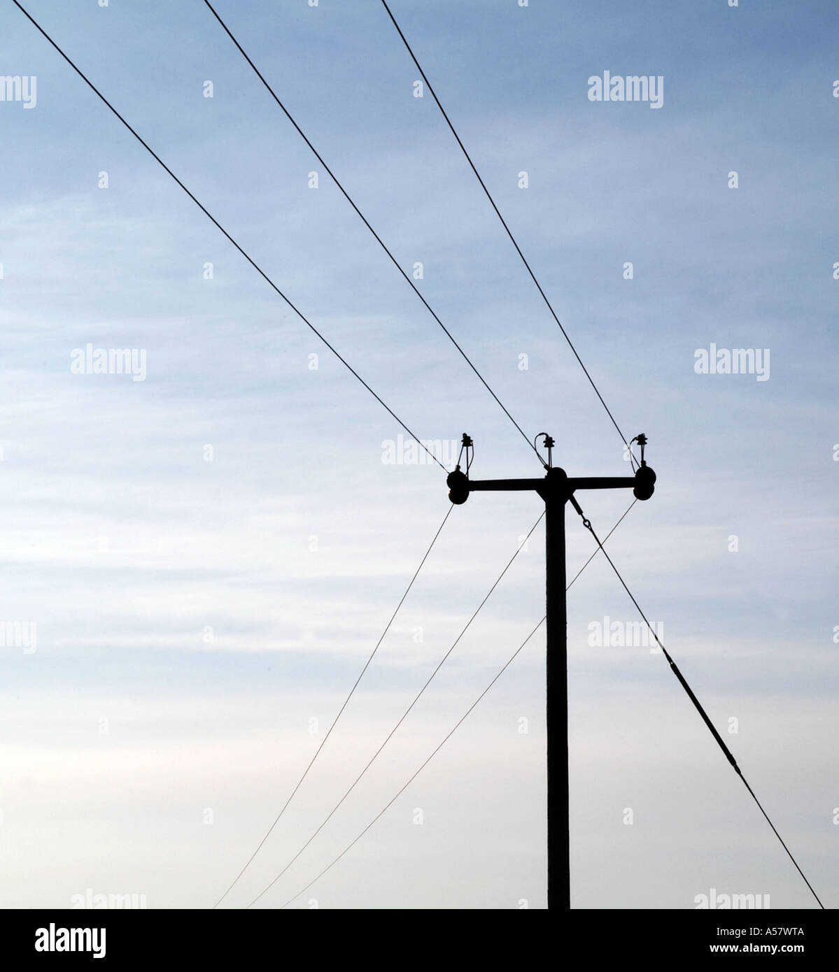 Electrical power lines and pylons against a blue sky Europe, UK england ...