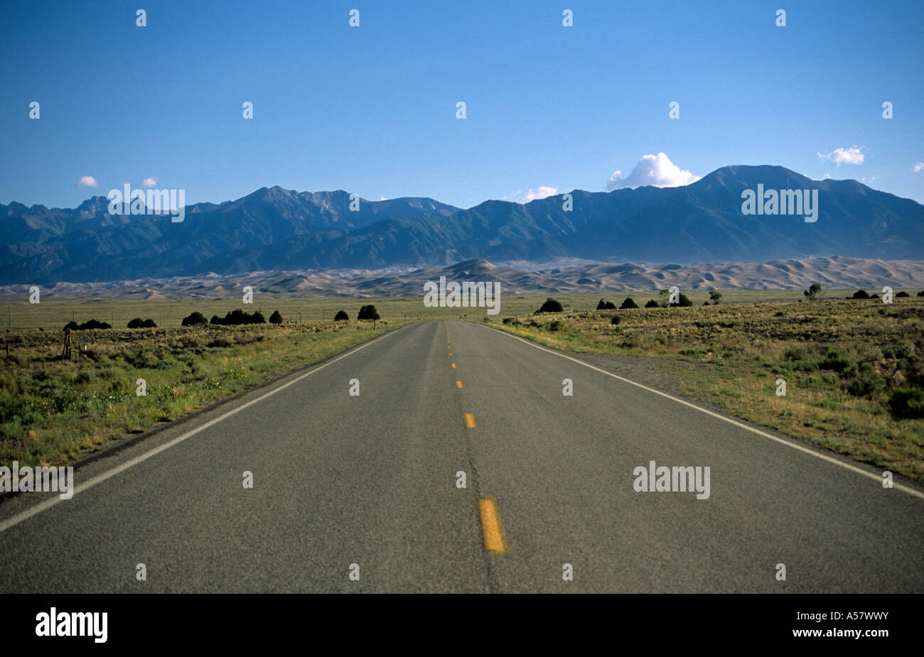 Highway approaching Great Sand Dunes National Park with Sangre de ...