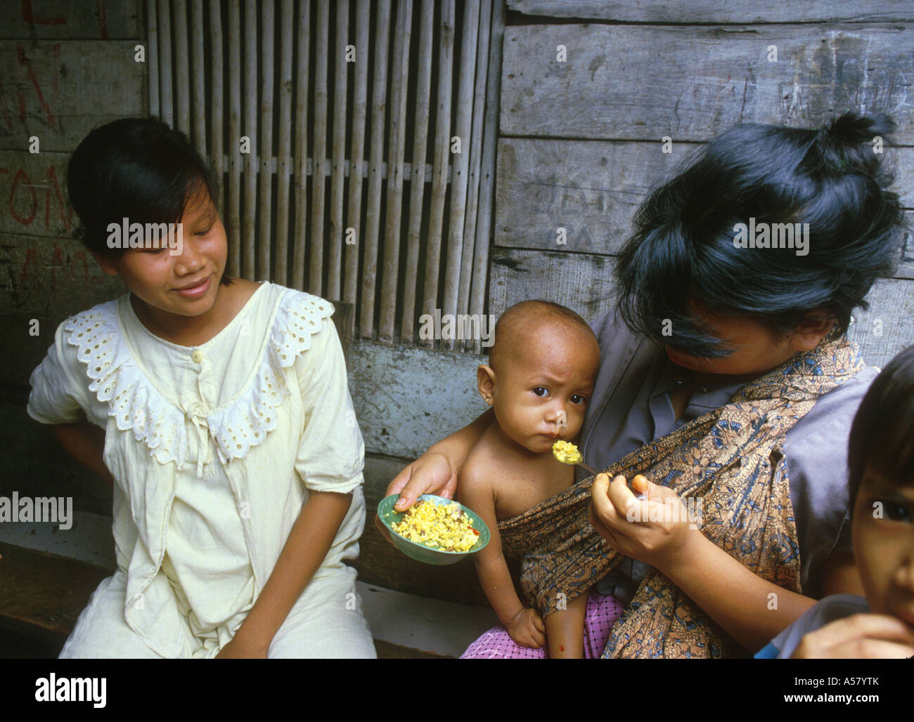 Painet ha2104 4223 indonesia mother girl baby feeding jakarta country ...