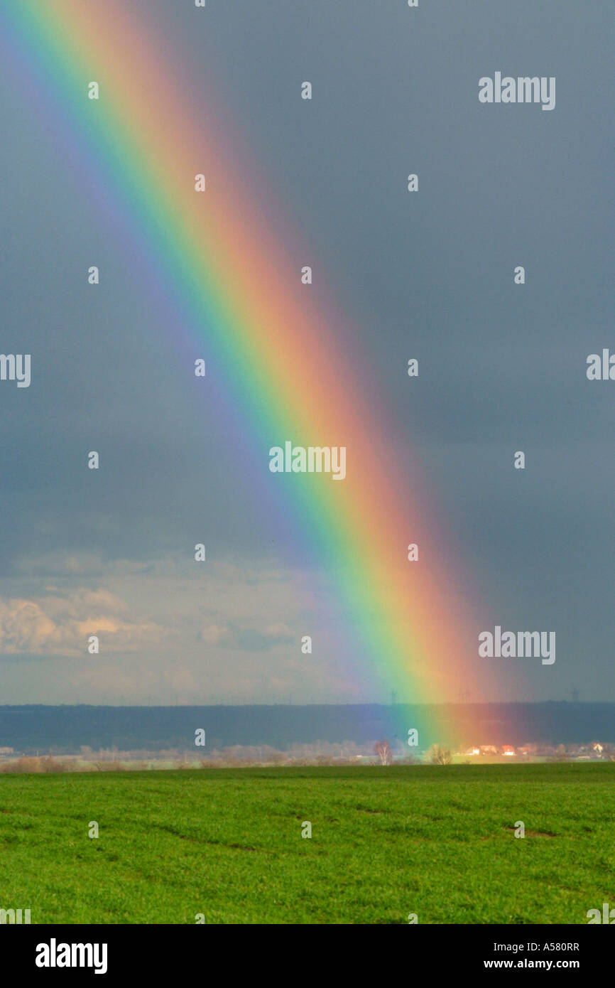 Simple landscape with rainbow Stock Photo - Alamy
