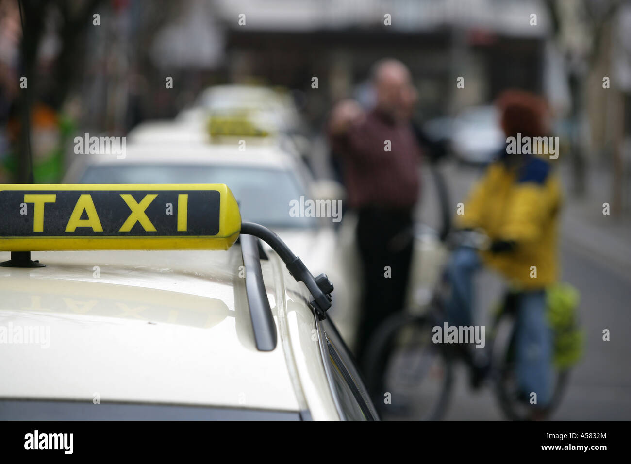 A cab is waiting at a taxi rank Stock Photo - Alamy