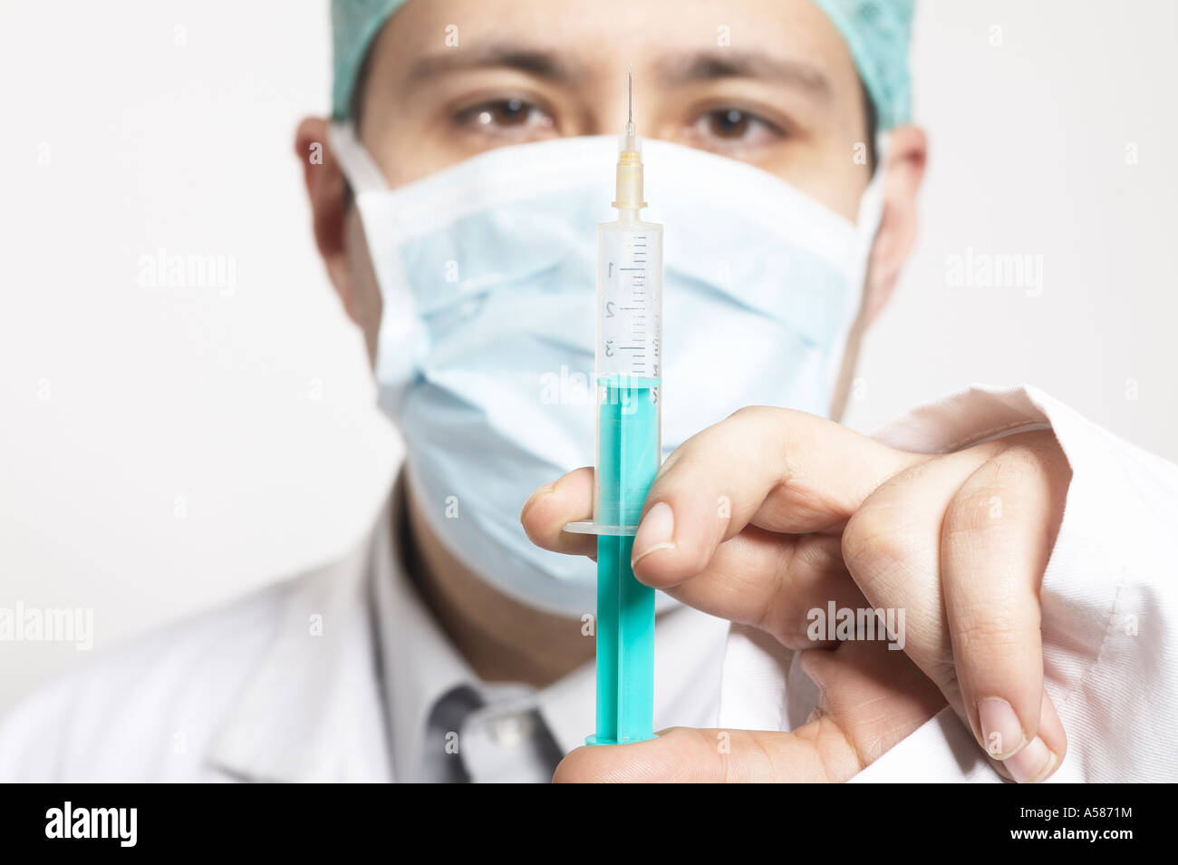 Surgeon with a syringe Stock Photo - Alamy