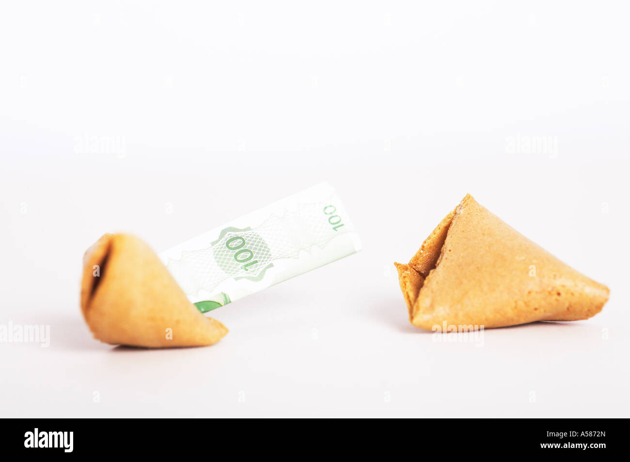 Fortune cookie with money Stock Photo - Alamy
