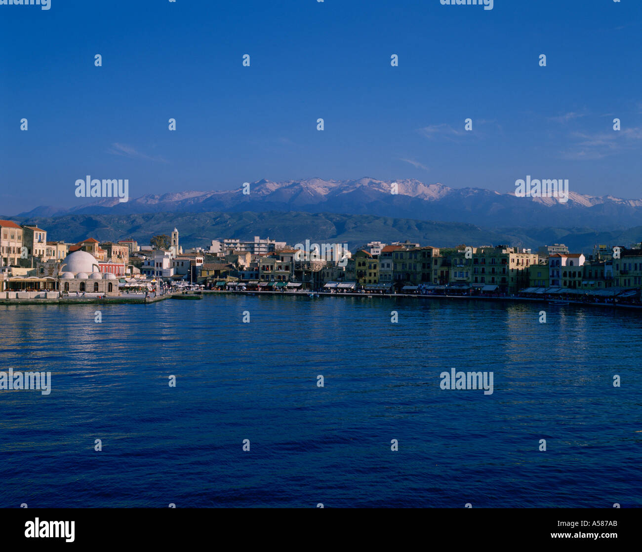 Chania harbor and snow capped White Mountains Lefka Ori western Crete ...