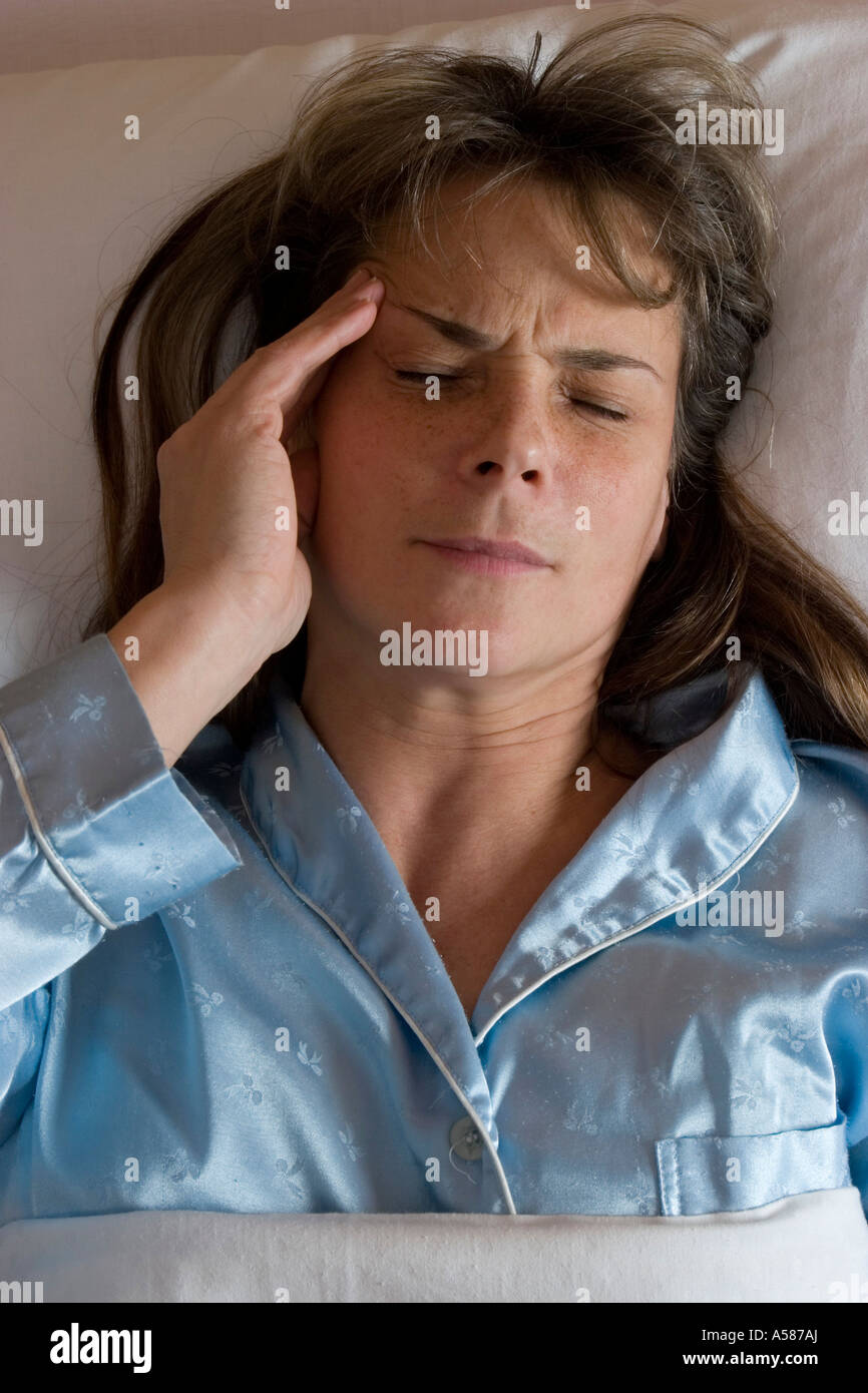 Woman with headache Stock Photo - Alamy