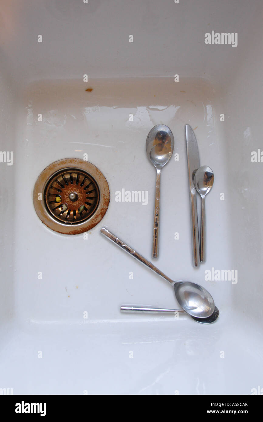 Ceramic kitchen sink with washing up Stock Photo - Alamy
