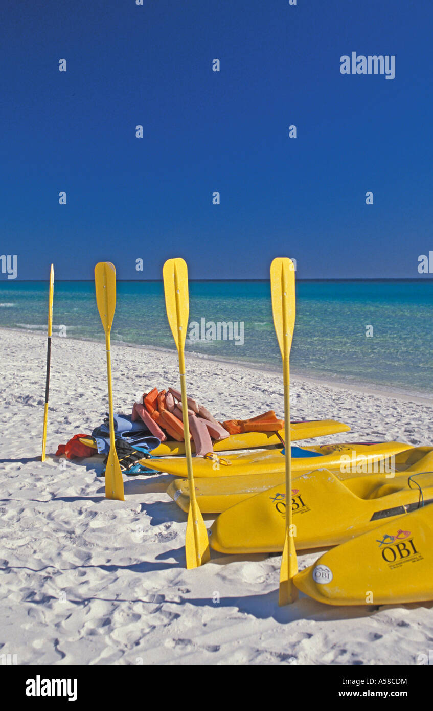 Beach bright colors yellow kayaks and paddles sport summer outdoor ...